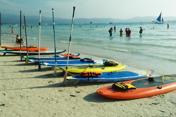 Get into water sports with paddle boarding - Activ4 school tours